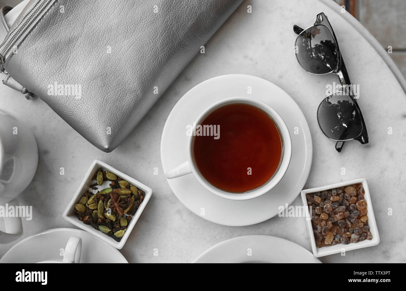 Modern cafe table with tea set Stock Photo - Alamy