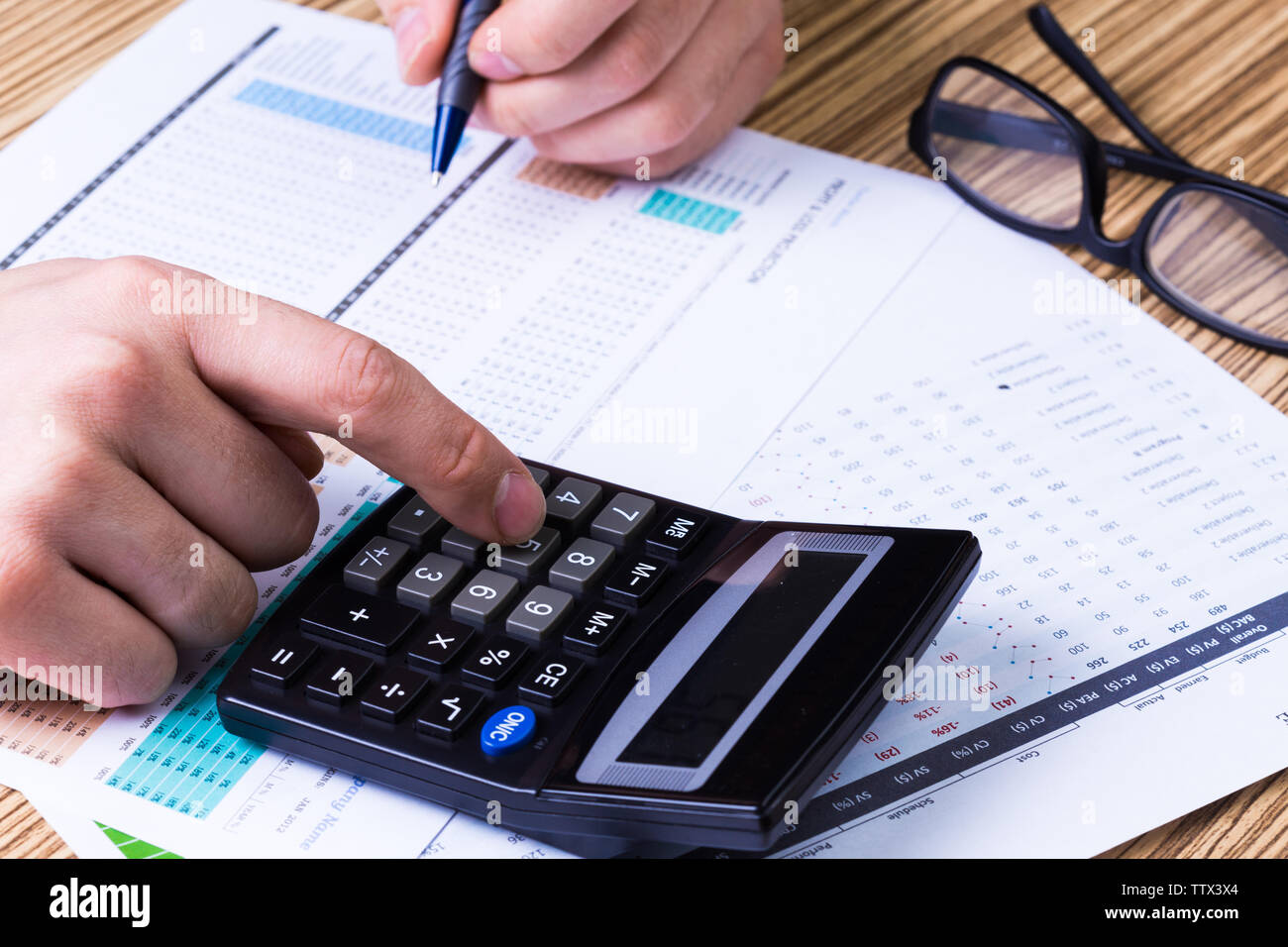 Graphs and Calculator Stock Photo - Alamy