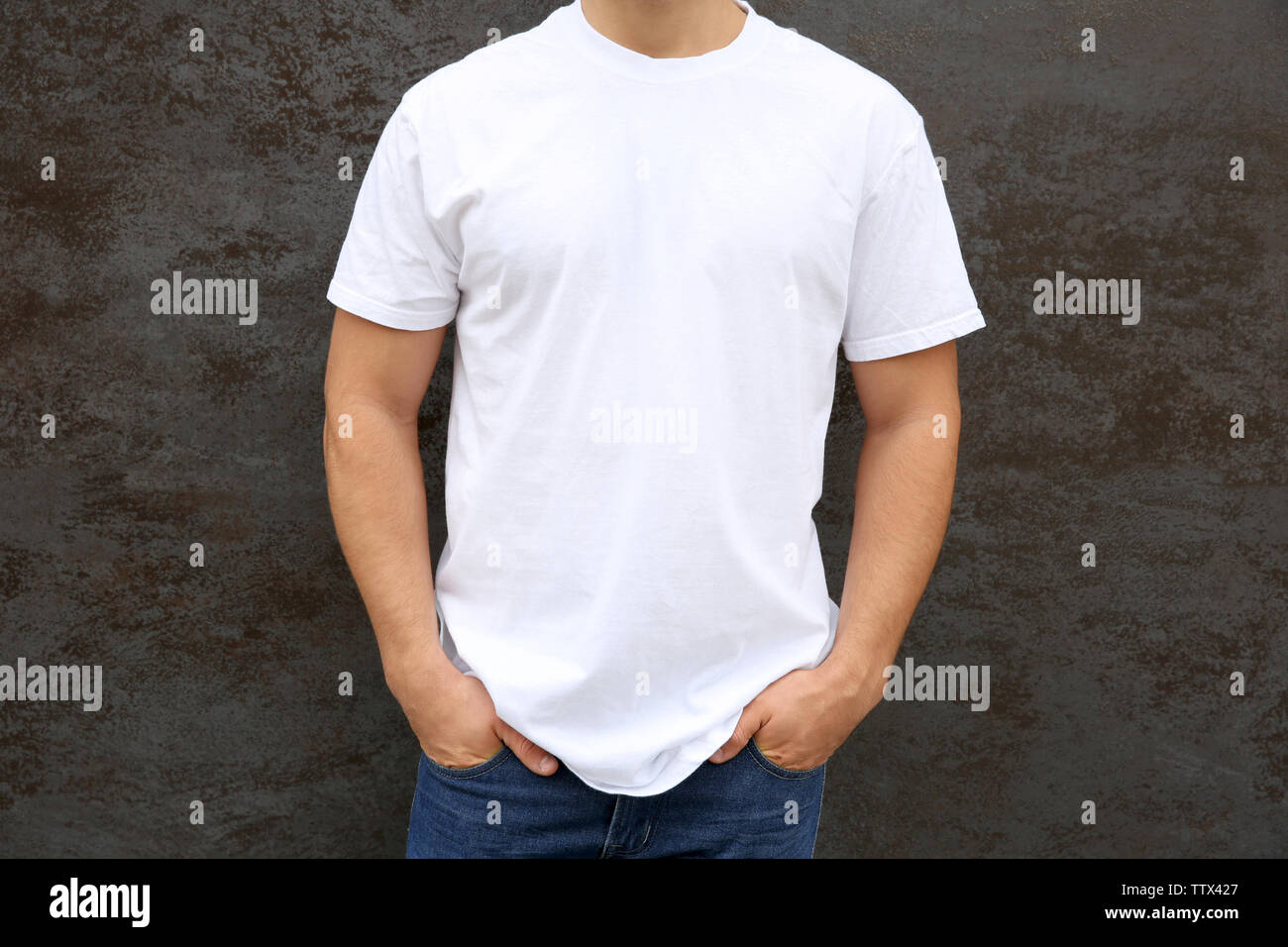 Man on wall background Stock Photo - Alamy