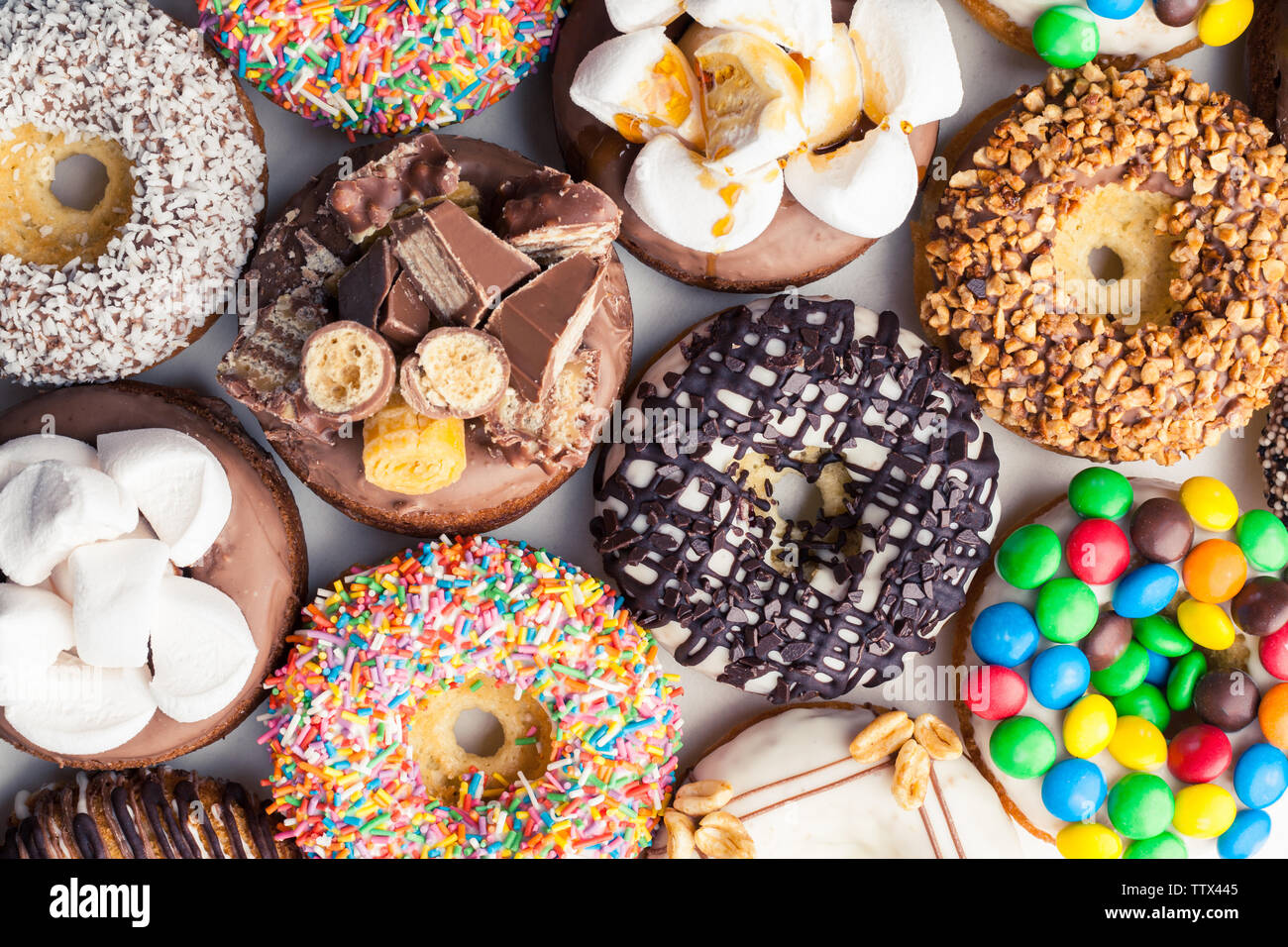 Close up of a selection of colorful donuts Stock Photo - Alamy