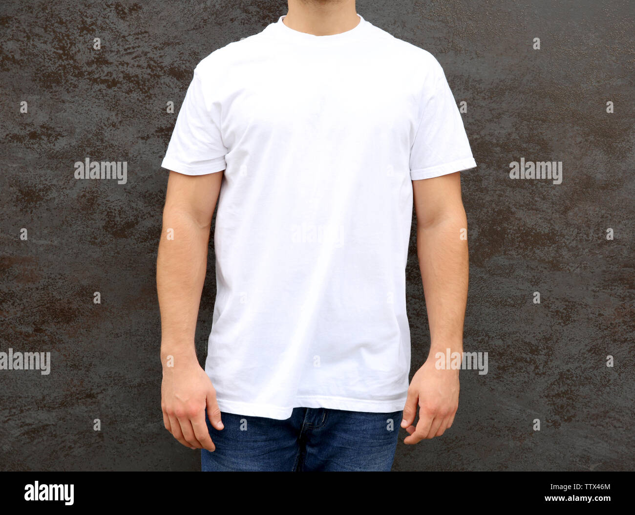 Man on wall background Stock Photo - Alamy