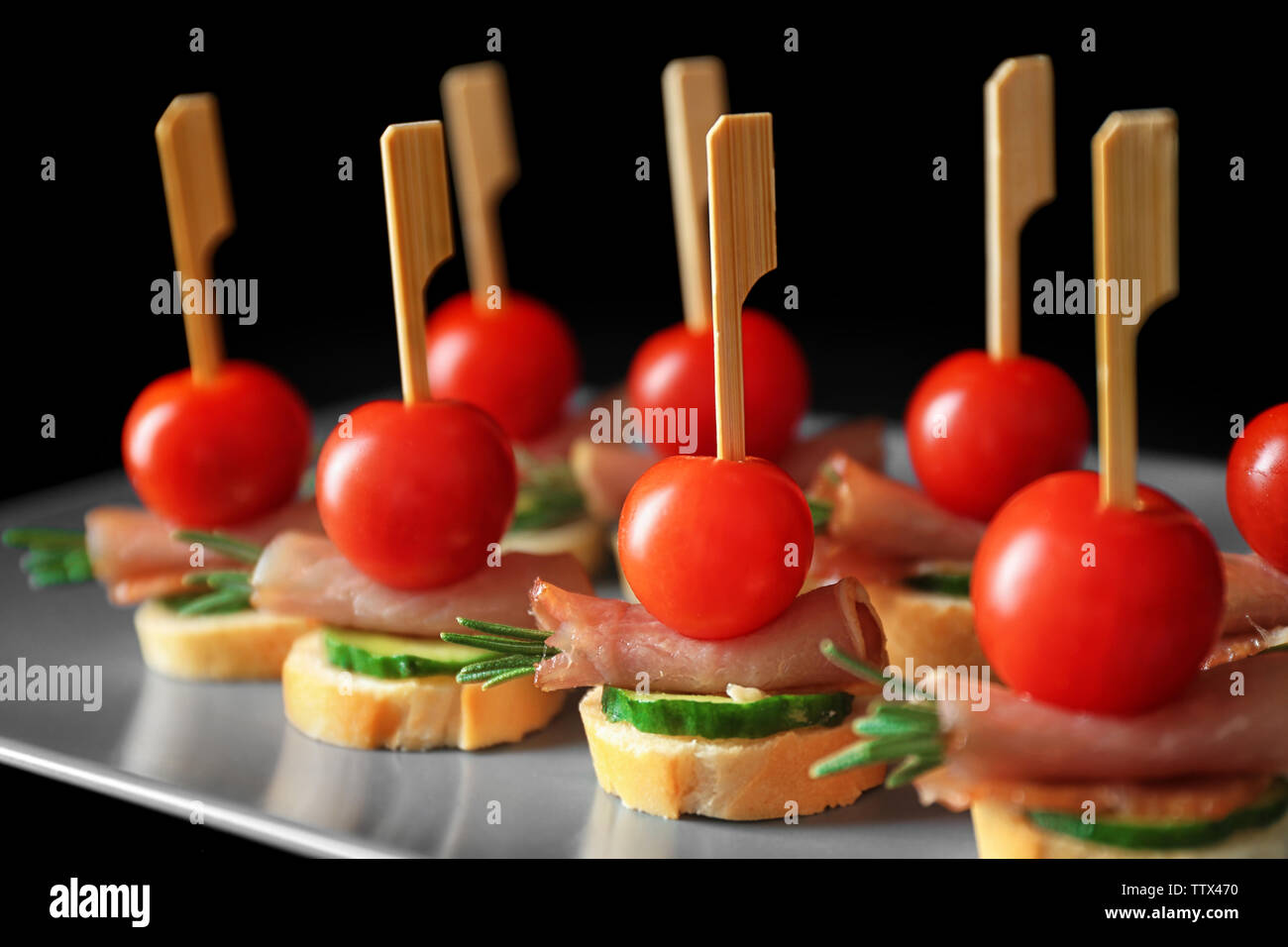 Set of delicious canapes on white plate, closeup Stock Photo - Alamy