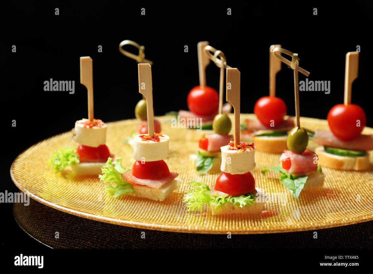 Set of delicious canapes on dark background Stock Photo - Alamy
