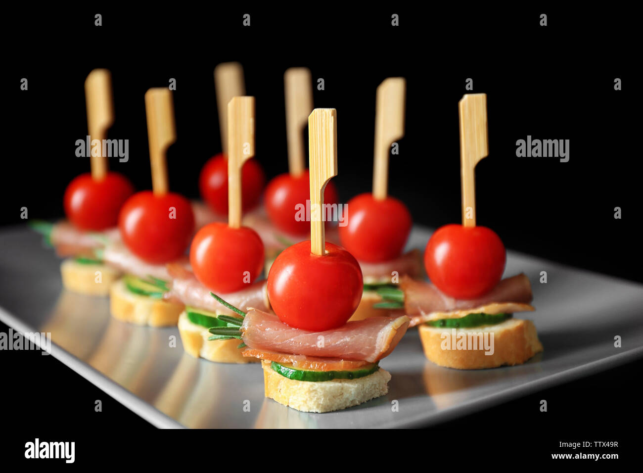 Set of delicious canapes on white plate, closeup Stock Photo - Alamy