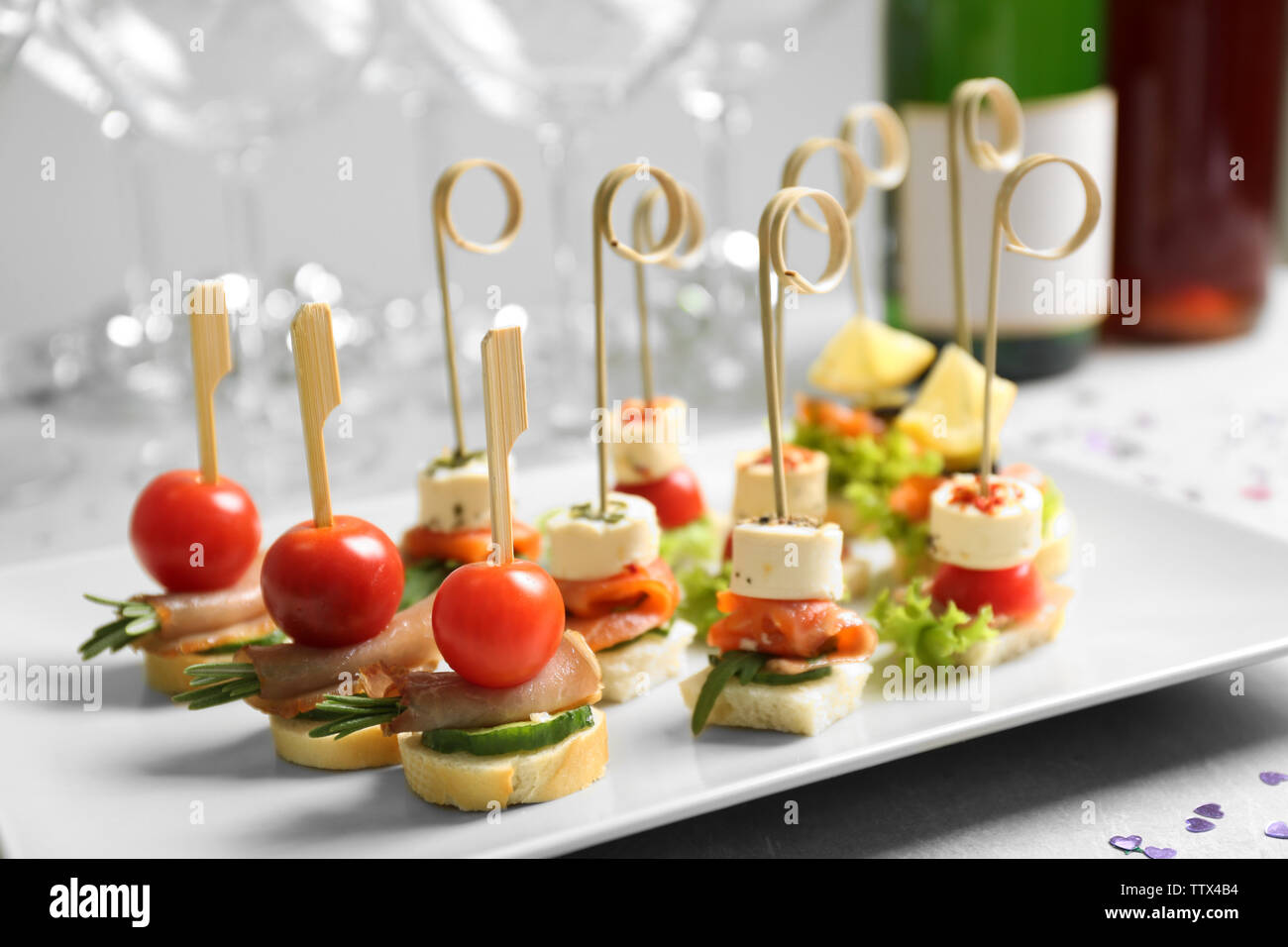 Assorted canapes on table closeup Stock Photo - Alamy