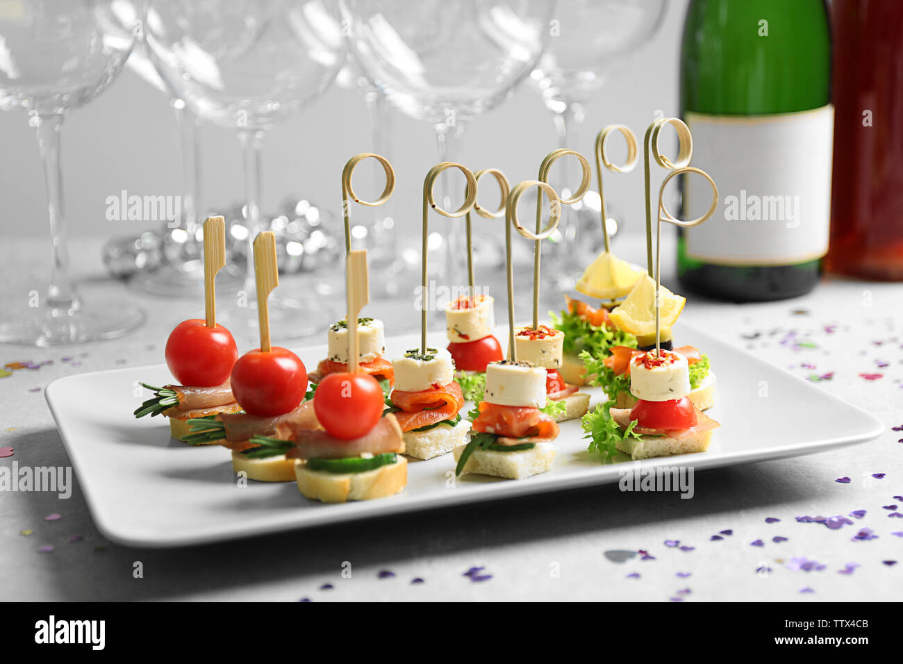 Assorted canapes on table closeup Stock Photo - Alamy
