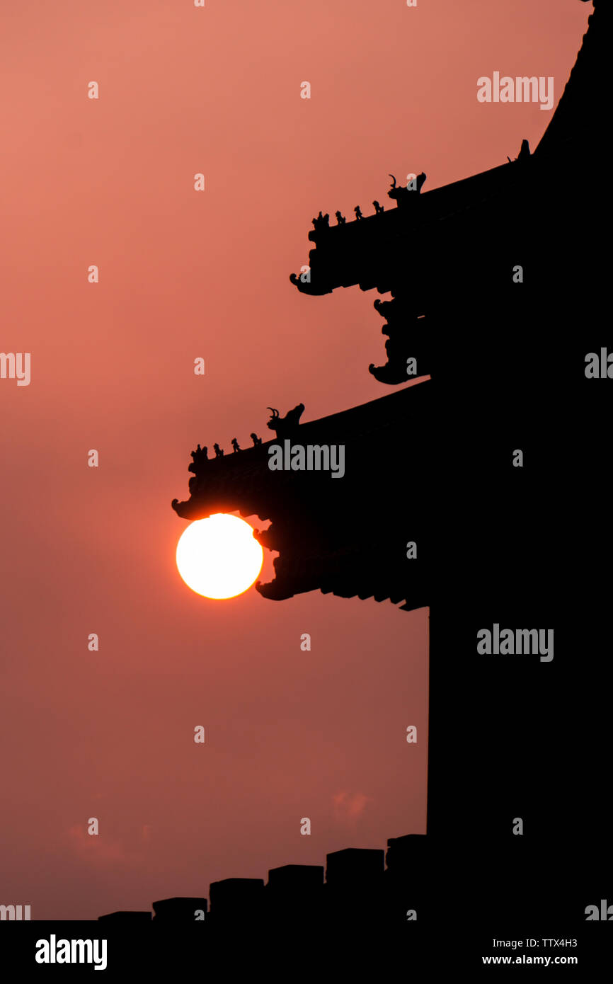The sunrise in the corner tower, the haze is probably thick here, and ...