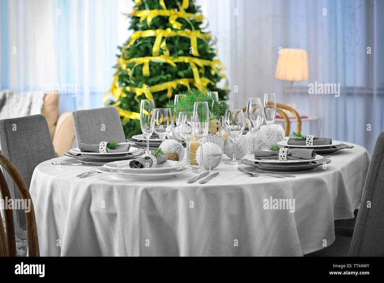 Table served for Christmas dinner in living room Stock Photo - Alamy