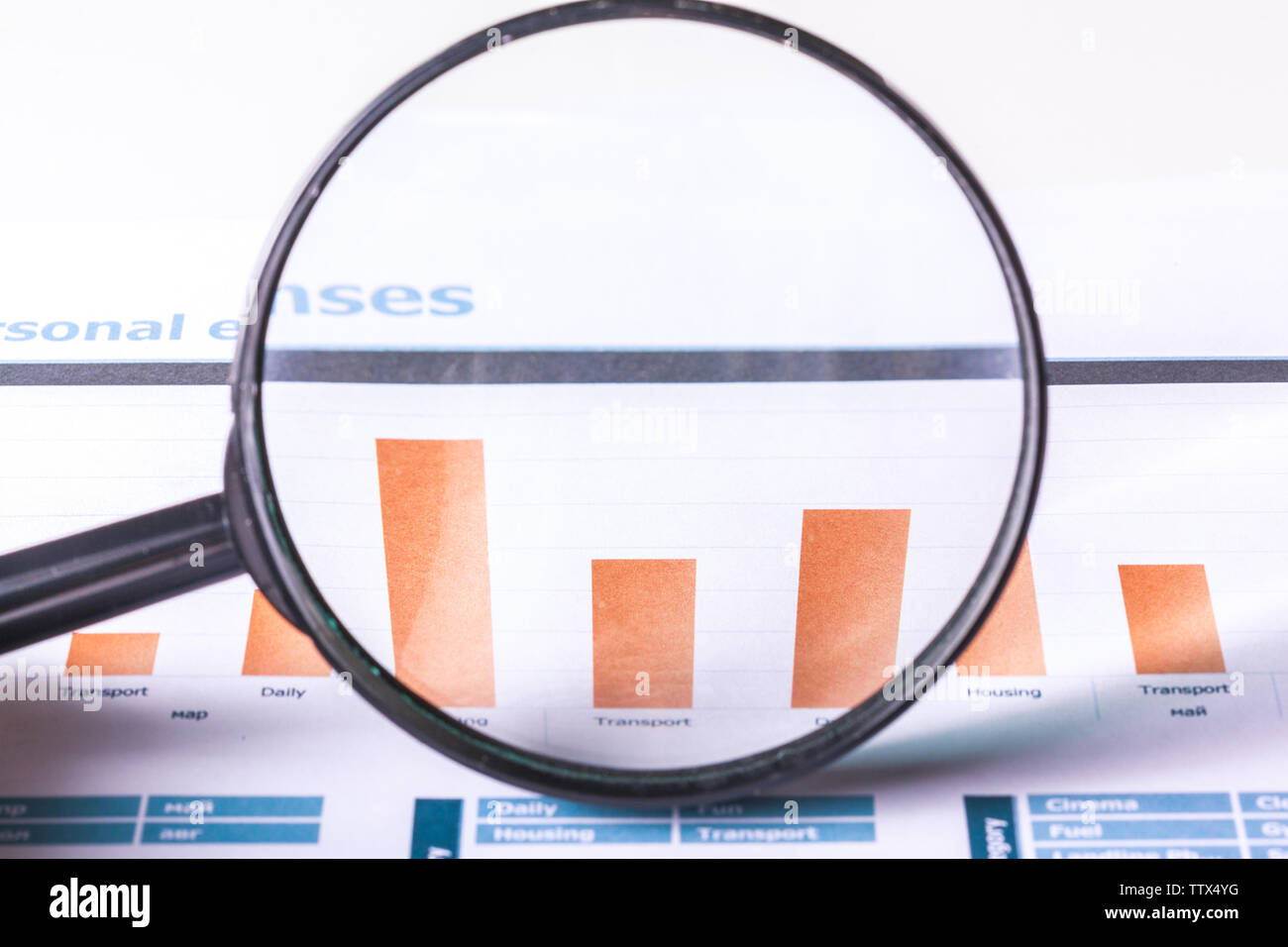 Magnifying glass and business growth graph Stock Photo - Alamy