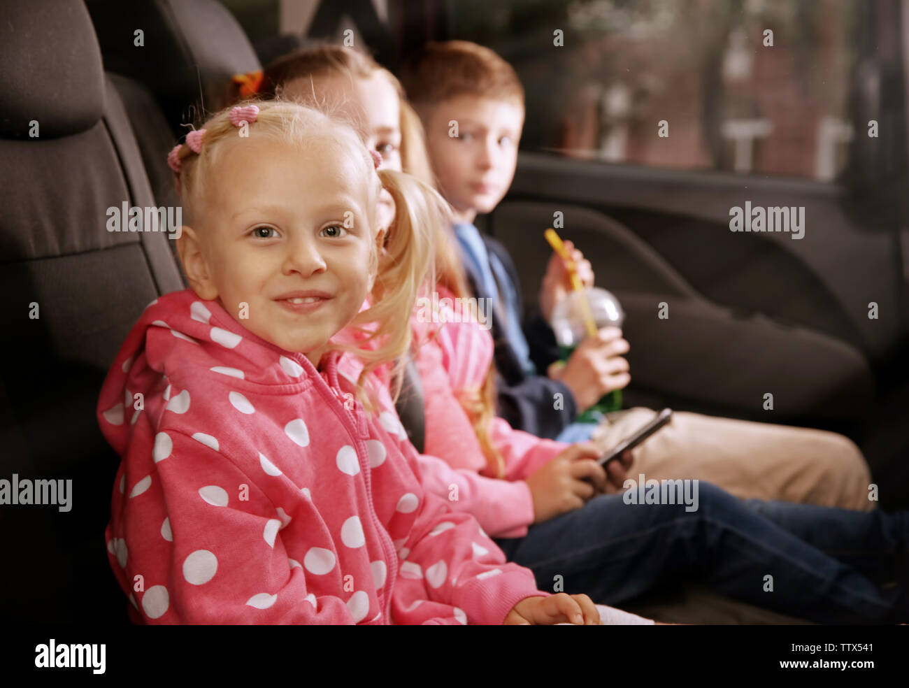 Cute children in a car Stock Photo - Alamy