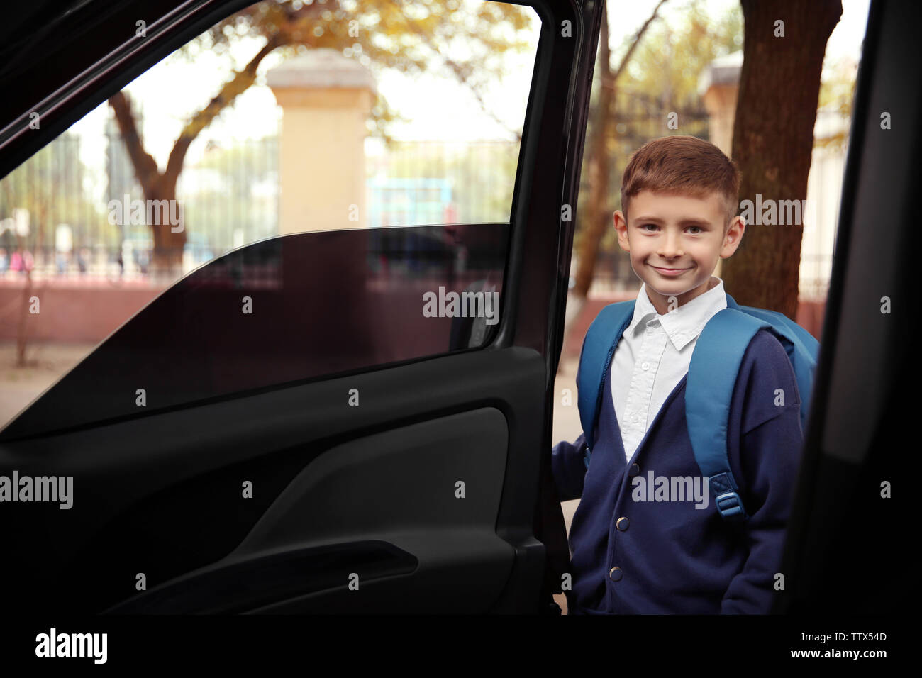 Little boy with backpack near a car, view from inside Stock Photo - Alamy