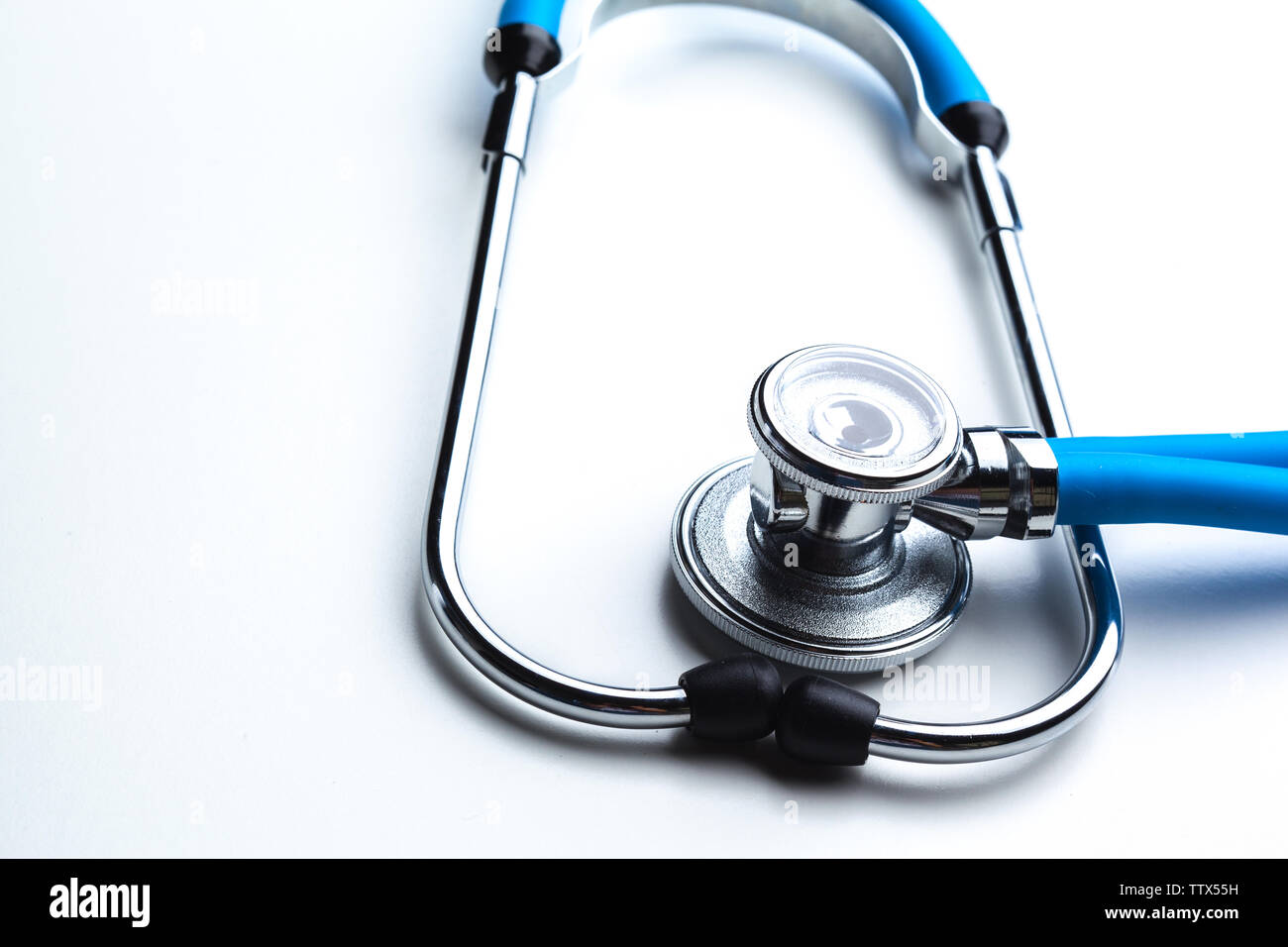 Blue stethoscope isolated on white Stock Photo - Alamy