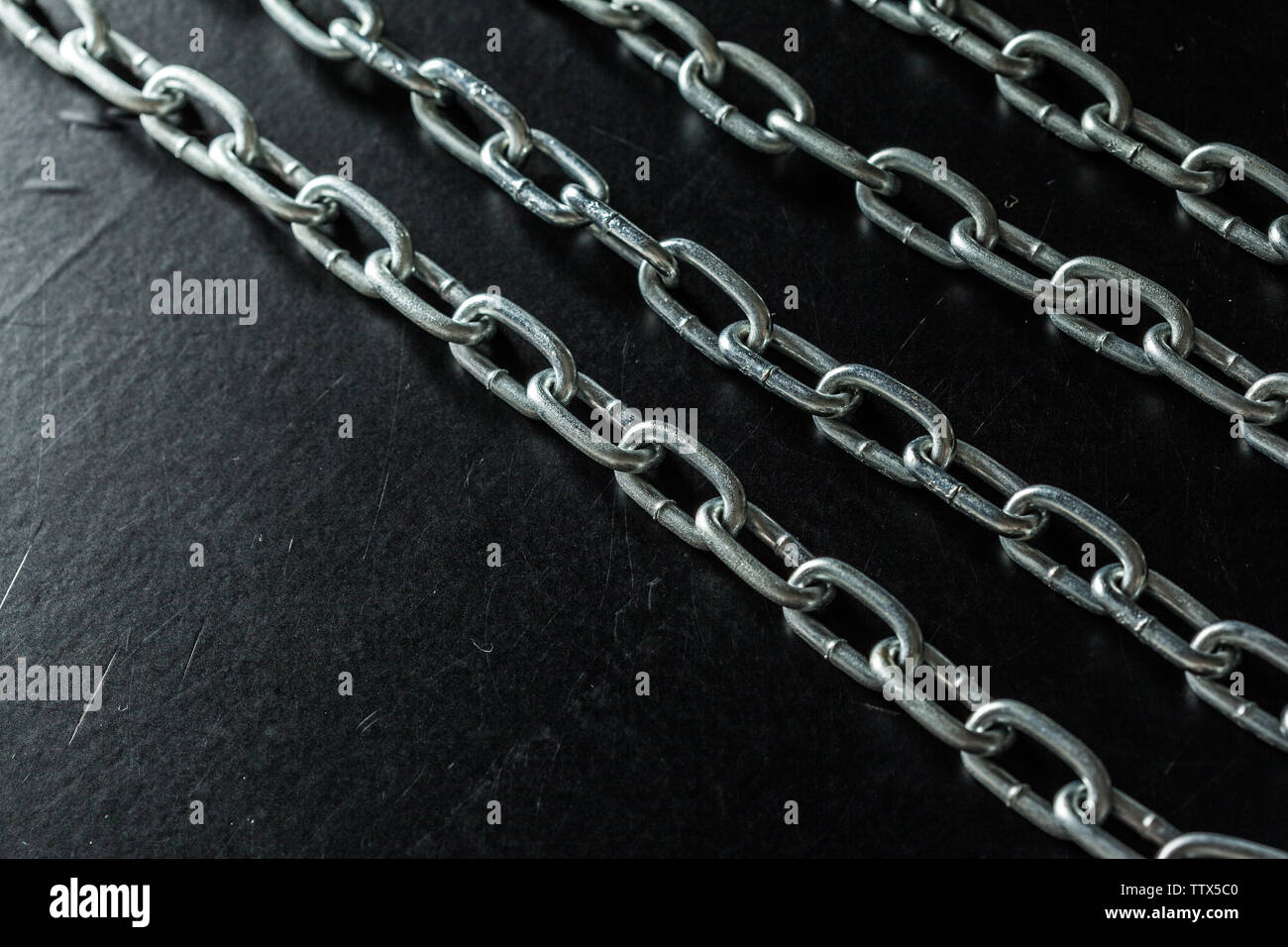 Strong chain black background Stock Photo - Alamy