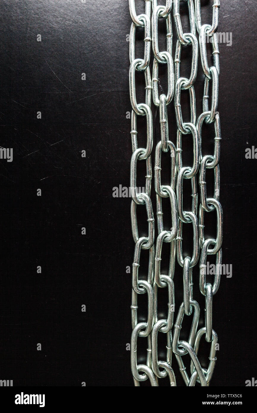 Strong chain black background Stock Photo - Alamy