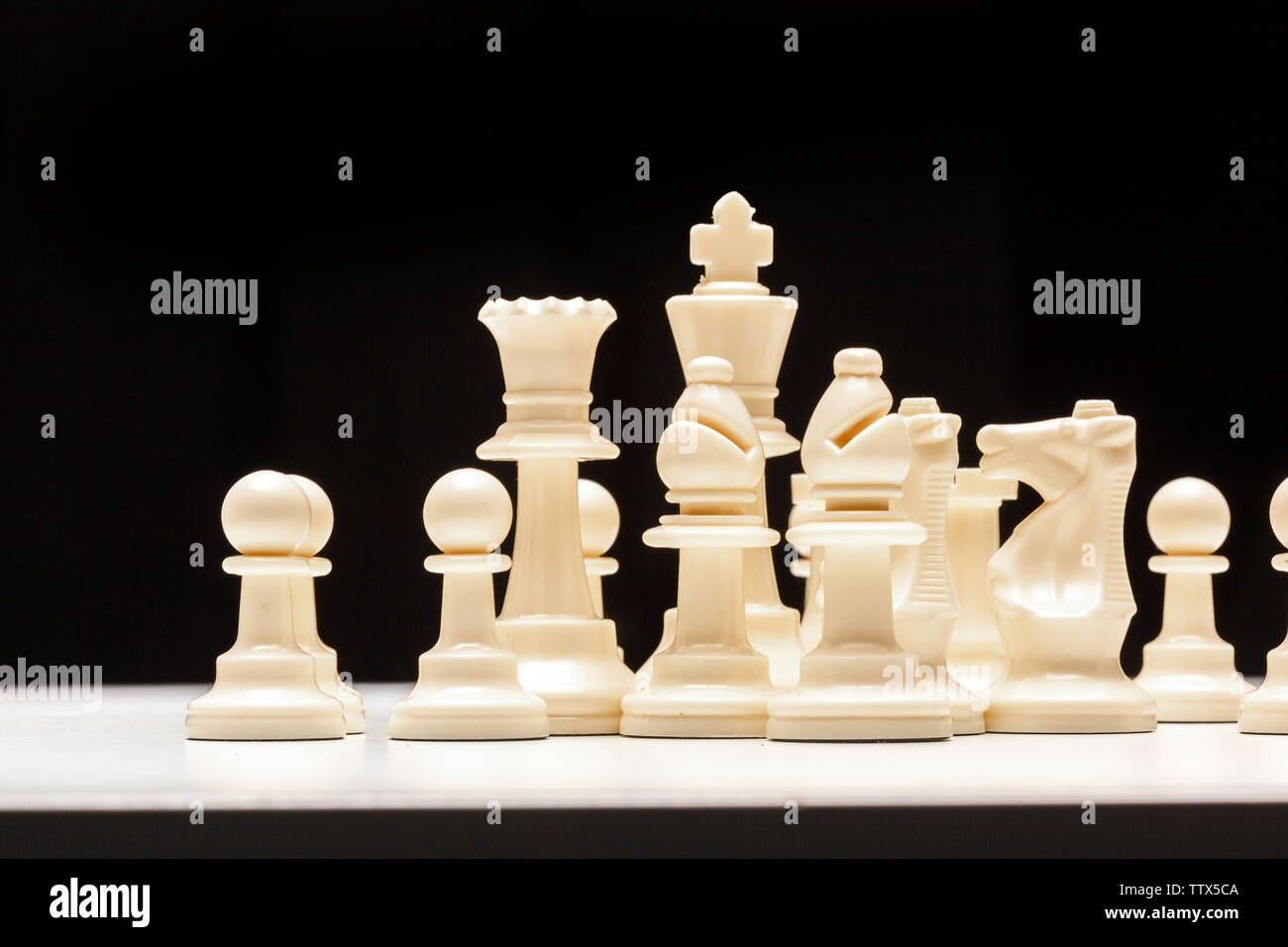 chess pieces on a black background Stock Photo - Alamy