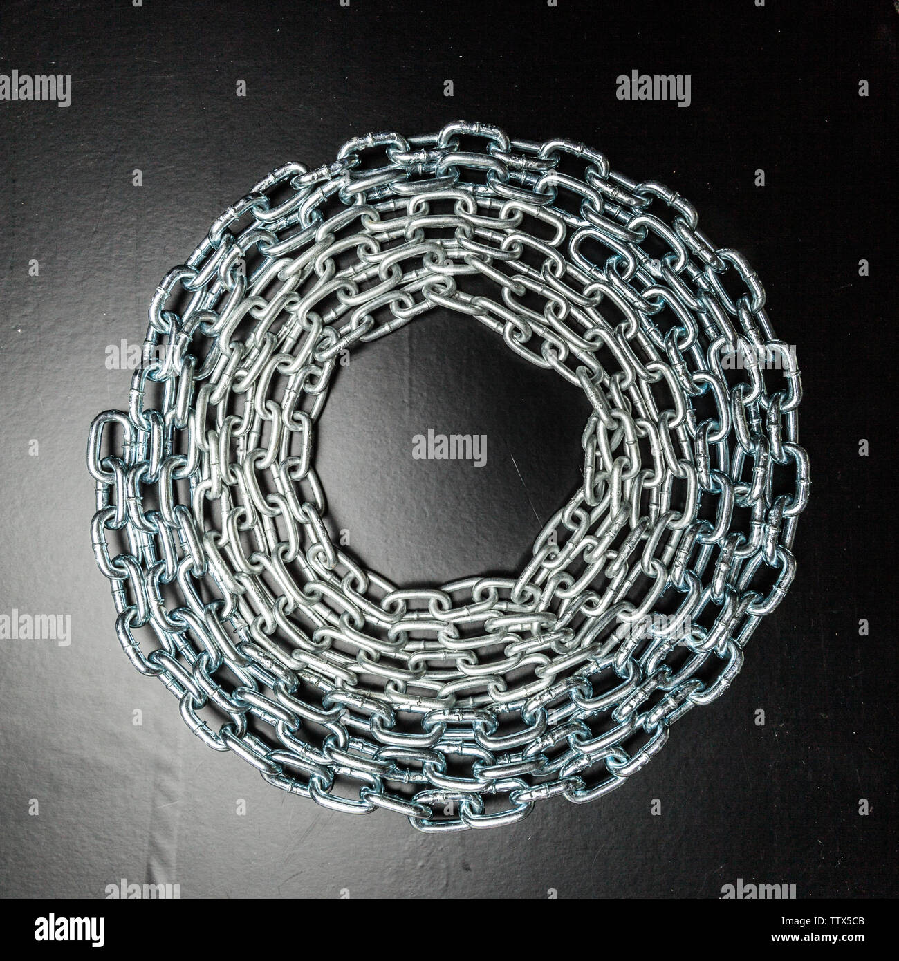 chains on a black background Stock Photo - Alamy