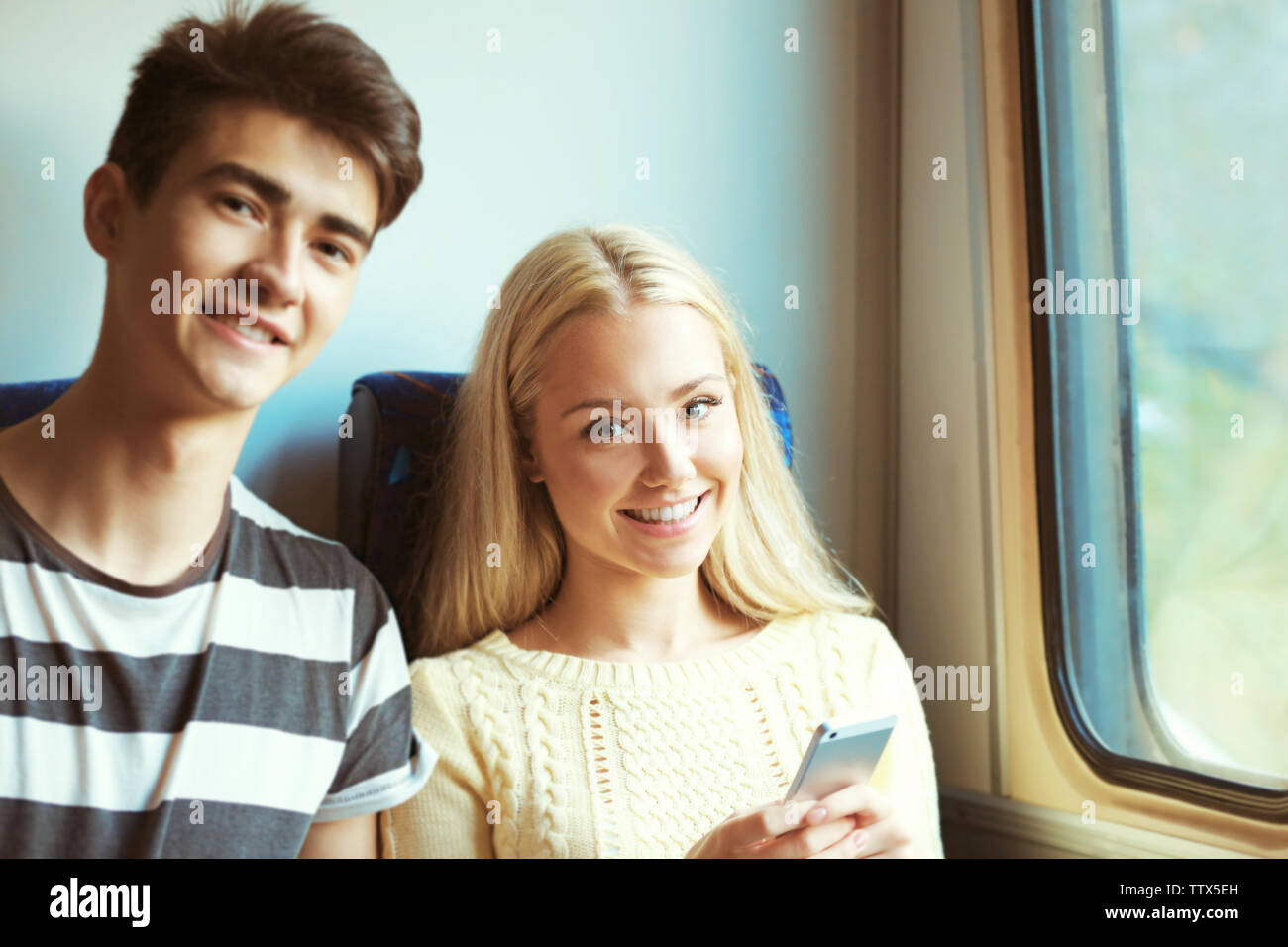 Couple travelling by train hi-res stock photography and images - Alamy