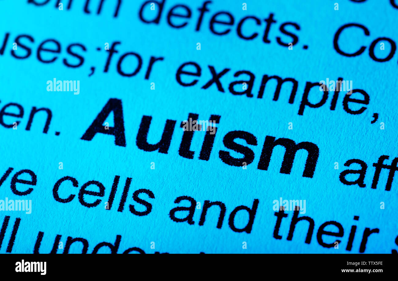Newspaper article with detailed word AUTISM, closeup Stock Photo - Alamy