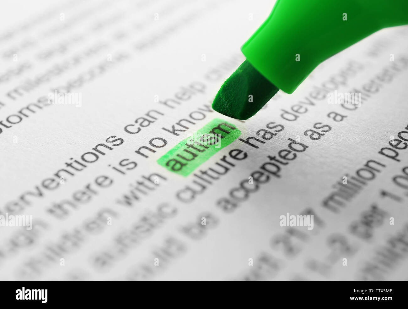 Newspaper article and word AUTISM underlined with green marker Stock ...