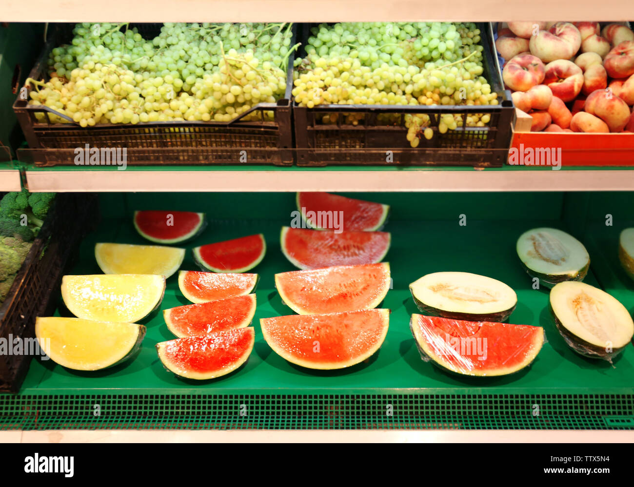 Fresh fruits on shelves in supermarket Stock Photo - Alamy