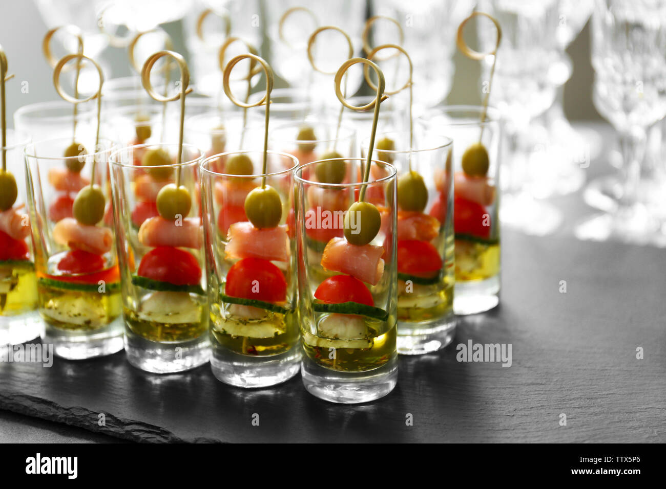 Fresh tasty canapes on slate plate, closeup Stock Photo - Alamy