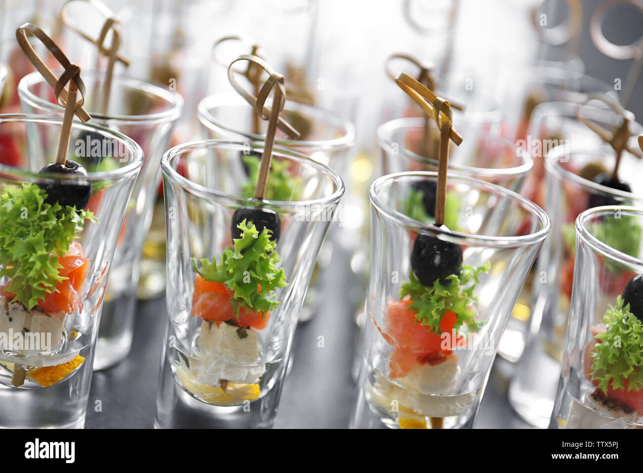 Fresh tasty canapes in glass cups, closeup Stock Photo - Alamy