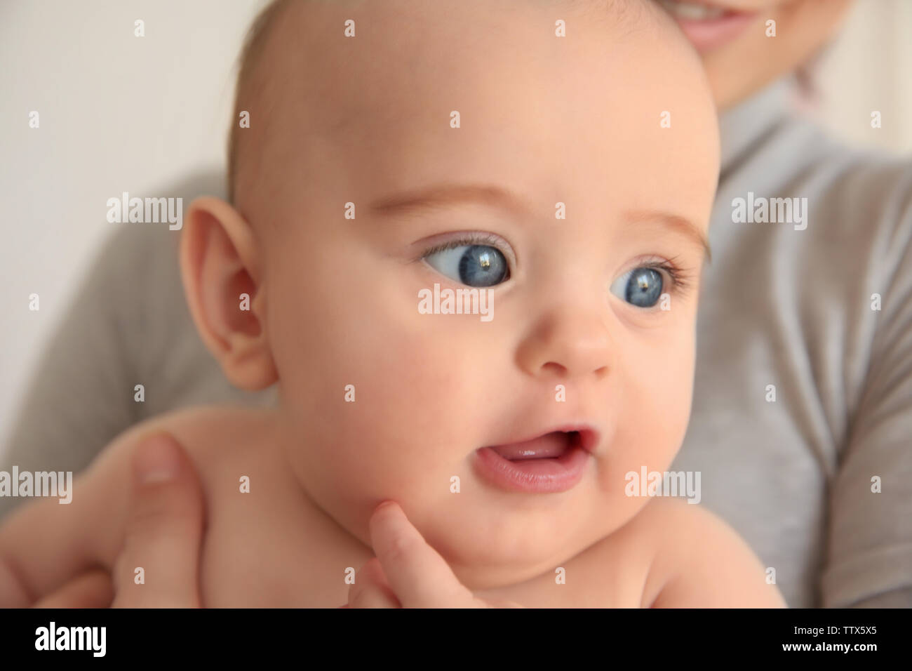 Close up view of cute curious baby Stock Photo - Alamy