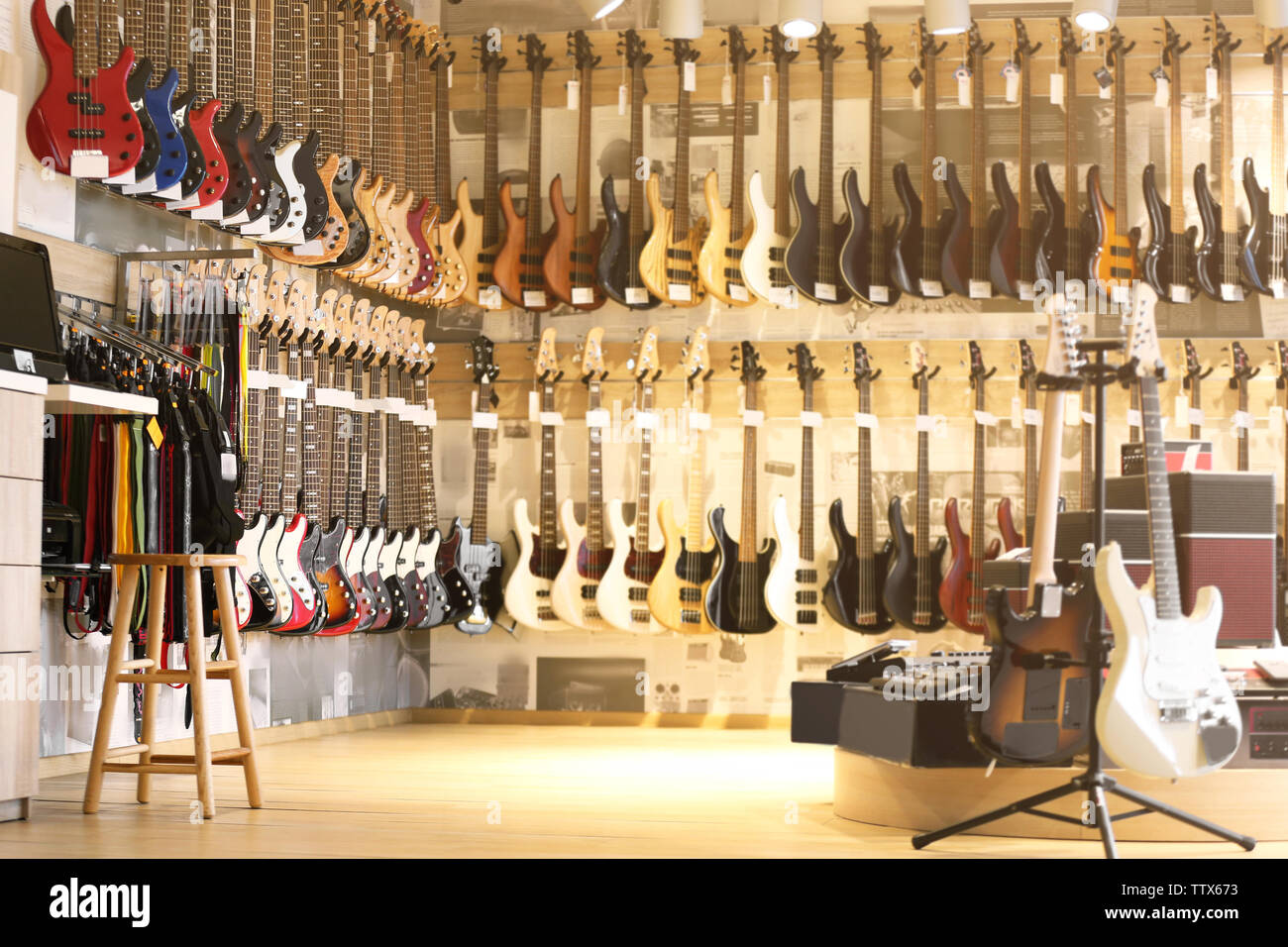 Guitars in music shop Stock Photo - Alamy