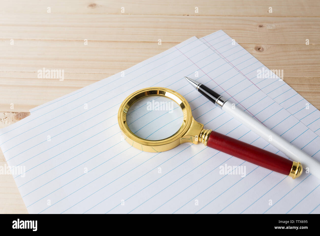 close-up of ball point pen over lined paper Stock Photo - Alamy