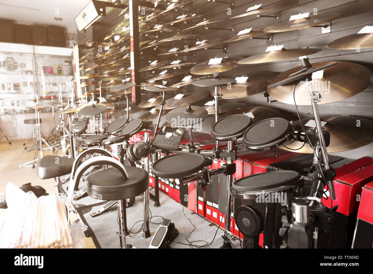 Drums accessories in music shop Stock Photo - Alamy