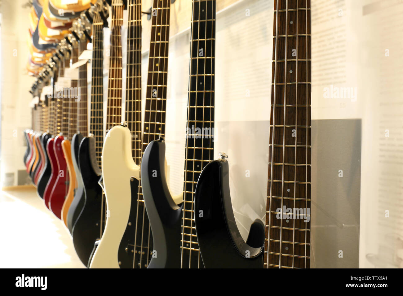 Guitars in music shop Stock Photo - Alamy
