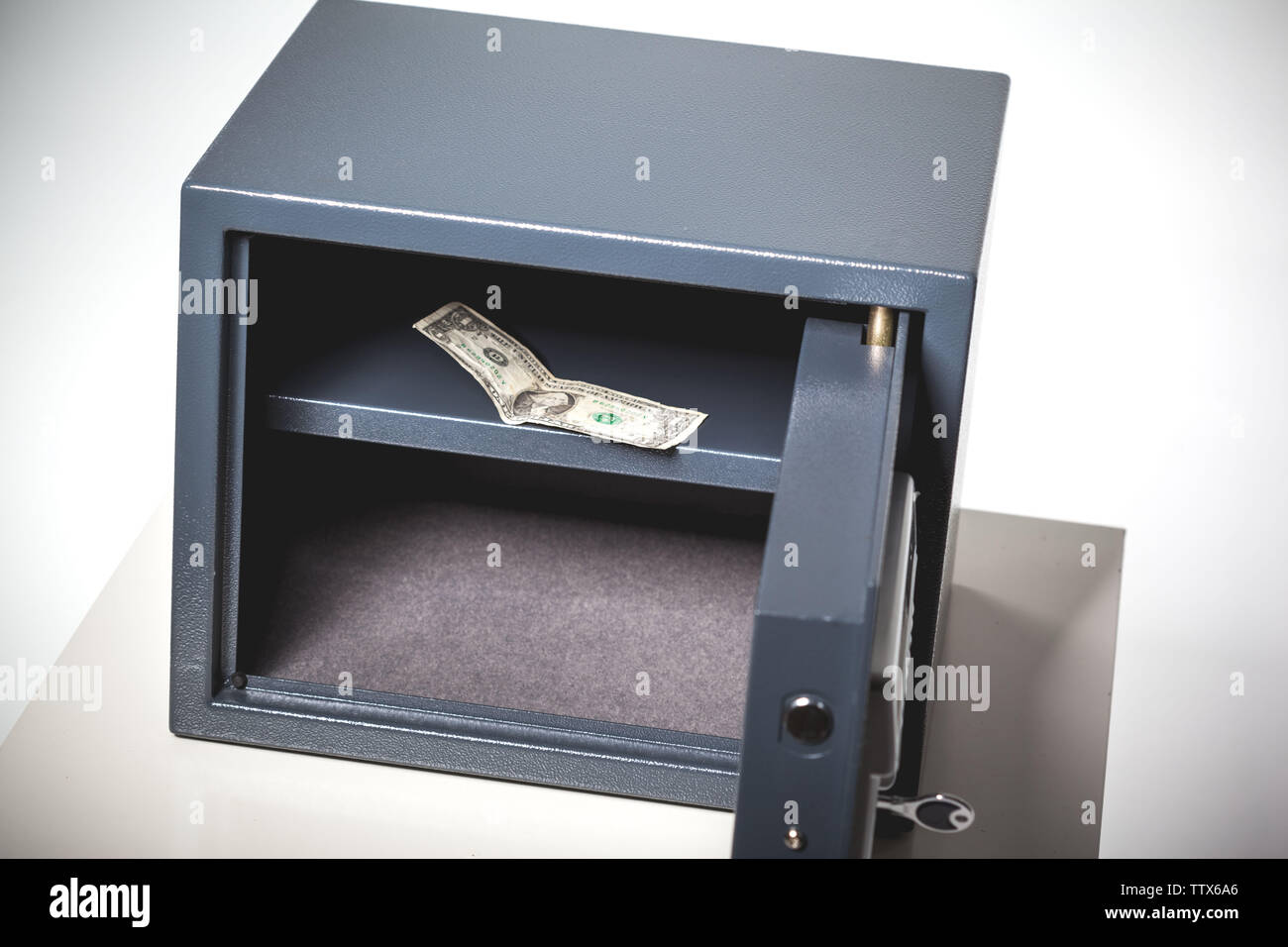 Safe with money Stock Photo - Alamy