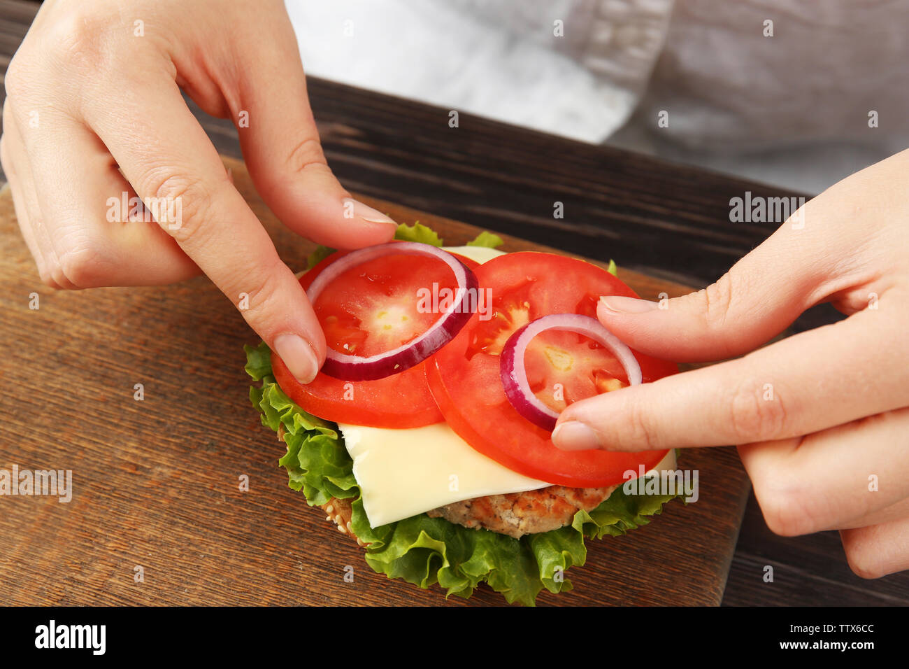 Female hands cooking tasty burger Stock Photo - Alamy