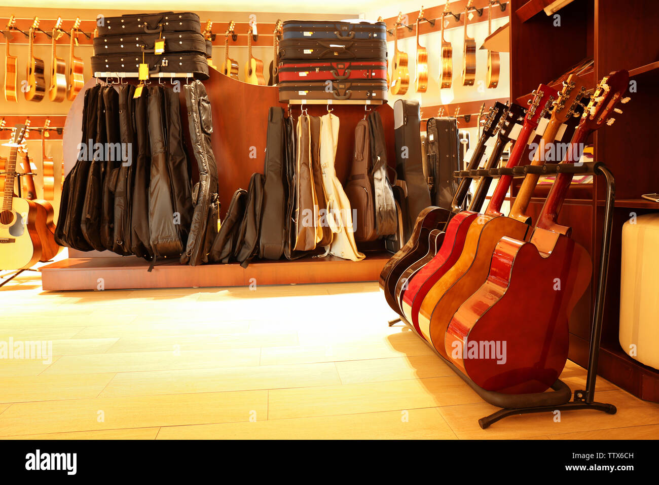 Guitars in music shop Stock Photo - Alamy
