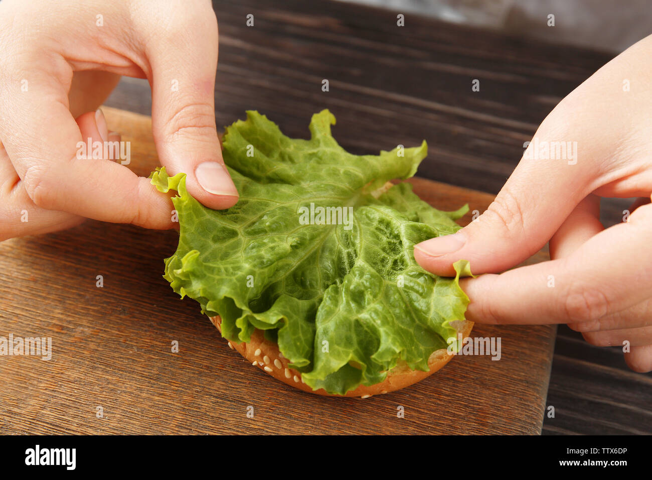 Female hands cooking tasty burger Stock Photo - Alamy