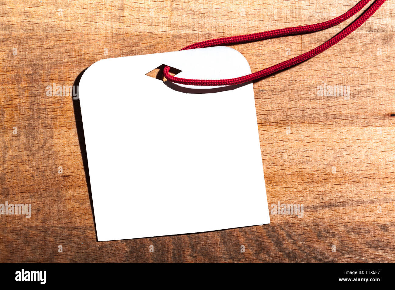 price tag label on wooden background Stock Photo - Alamy