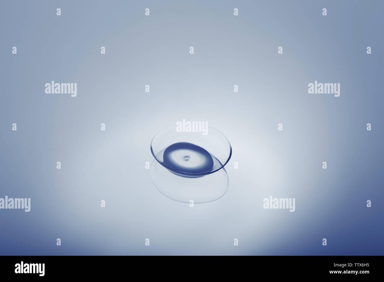 Contact lens on smooth background, close up view. Medicine and vision ...