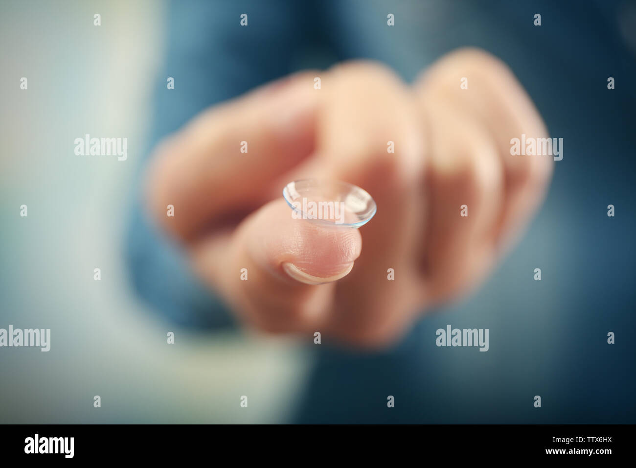 Contact lens on female finger, close up view. Medicine and vision ...