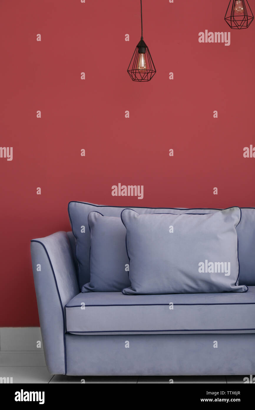 New cozy sofa in empty room Stock Photo - Alamy
