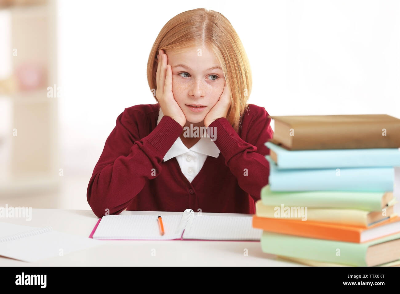 Schoolgirl doing lessons at home Stock Photo - Alamy