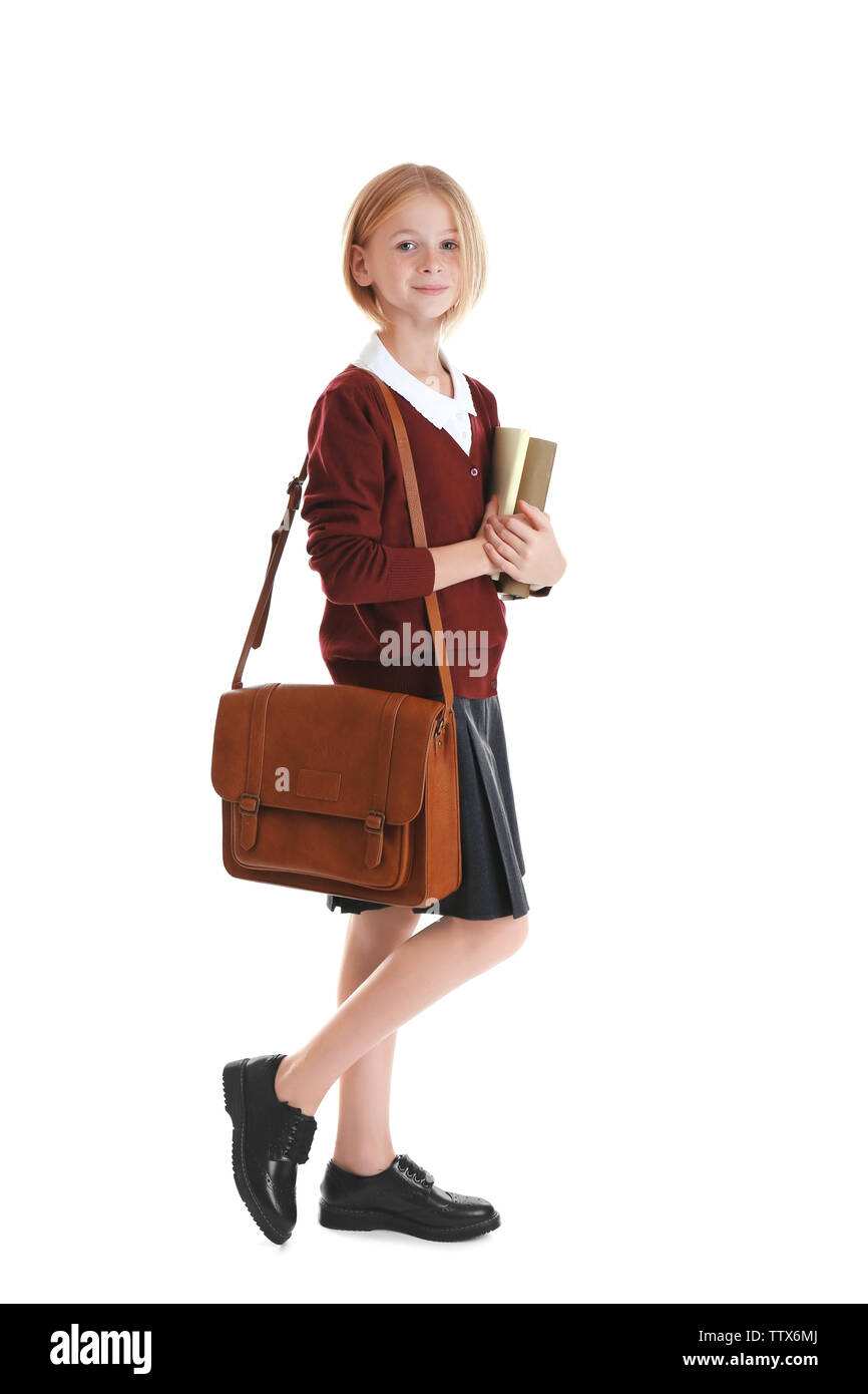 Schoolgirl with books and bag isolated on white Stock Photo - Alamy