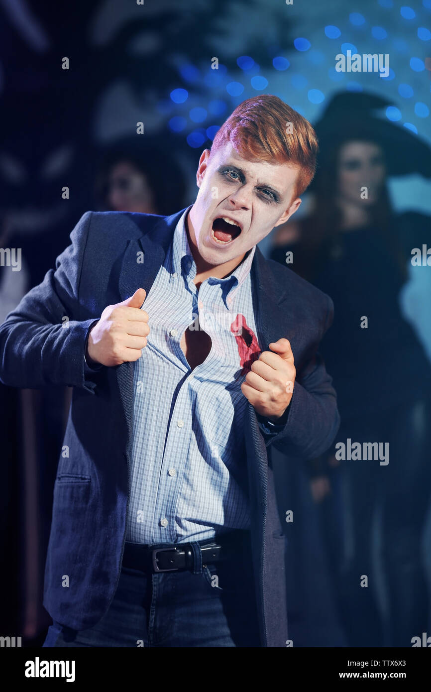 Guy dressed as dead man at Halloween party Stock Photo - Alamy