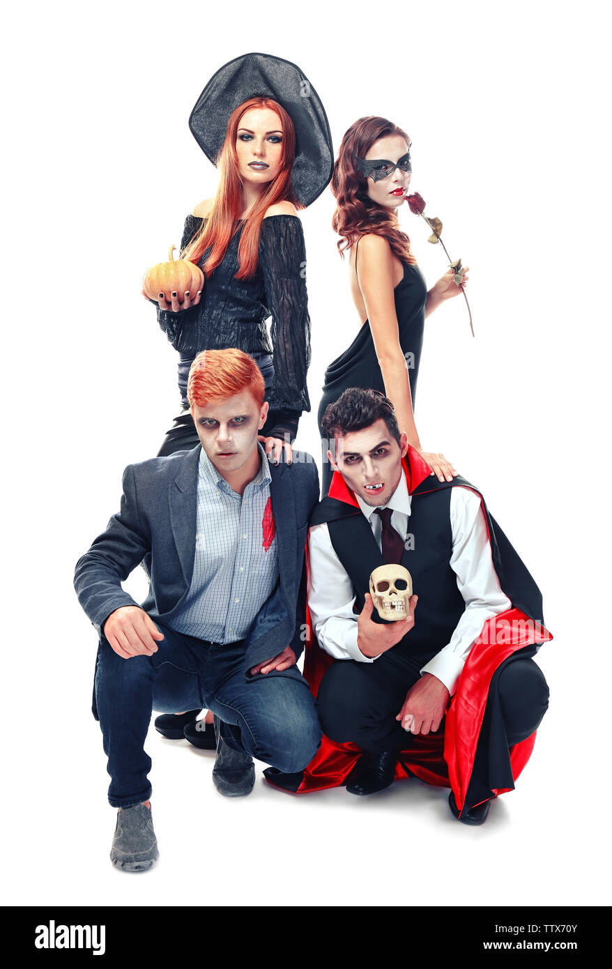 Young people dressed in different costumes for Halloween, isolated on ...