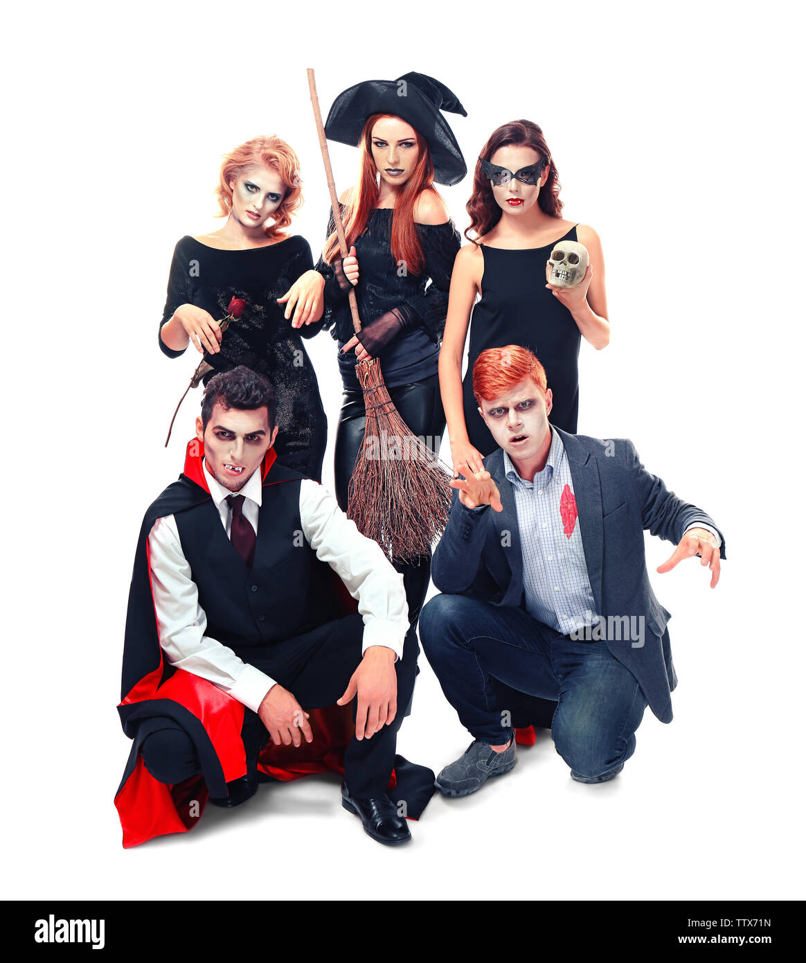 Young people dressed in different costumes for Halloween, isolated on ...