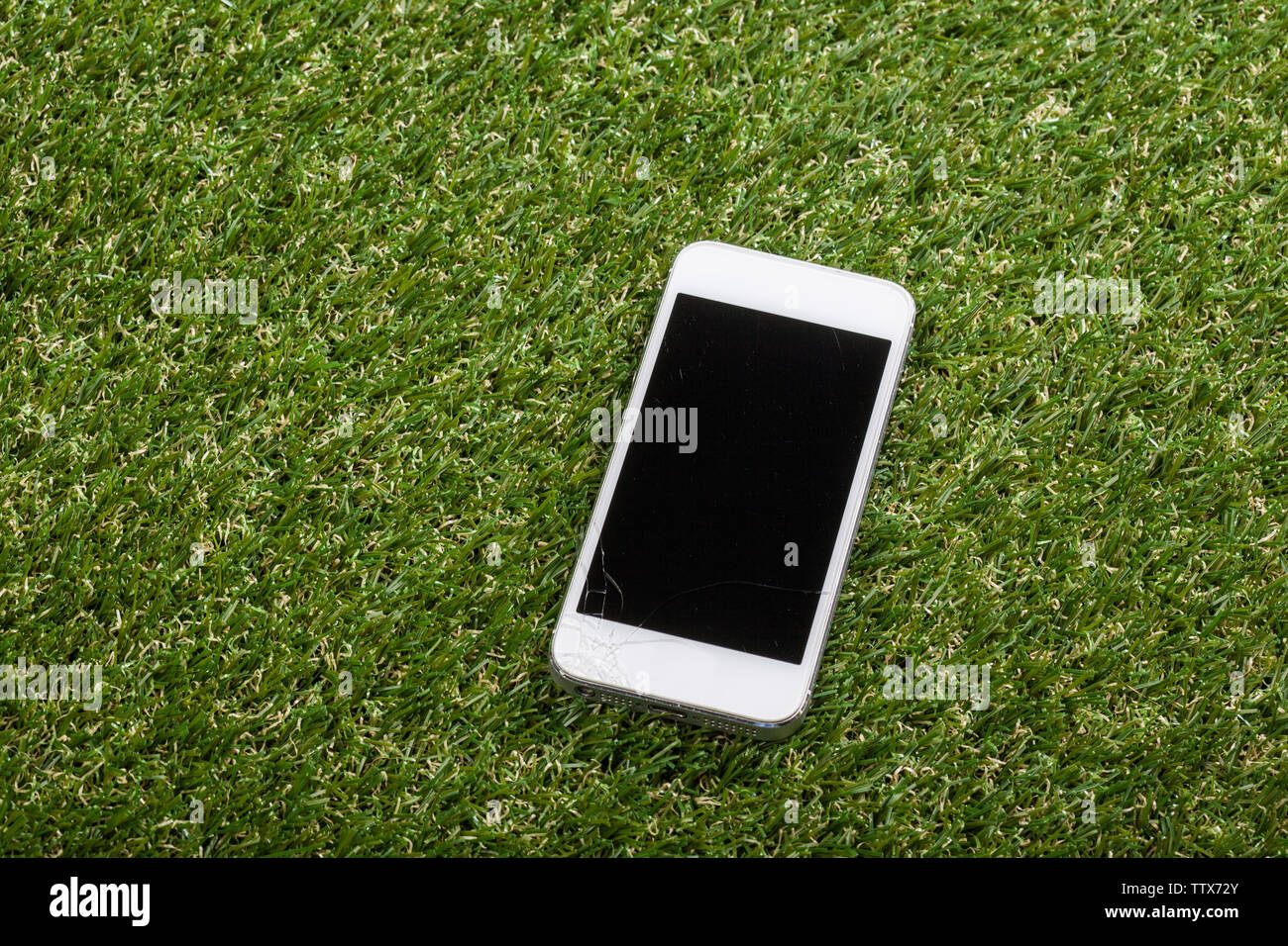 Smartphone drop to the floor and screen damage Stock Photo - Alamy