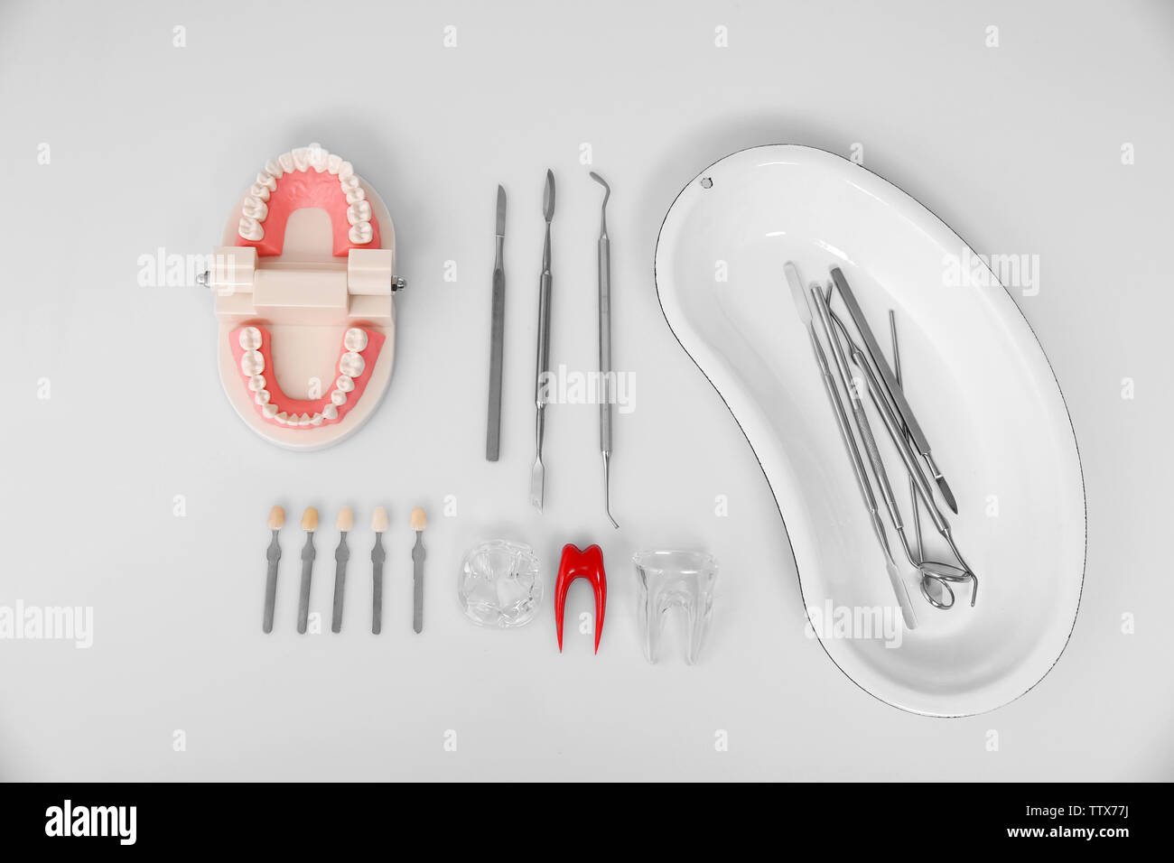 Dentist tools and teeth on white background, top view Stock Photo - Alamy