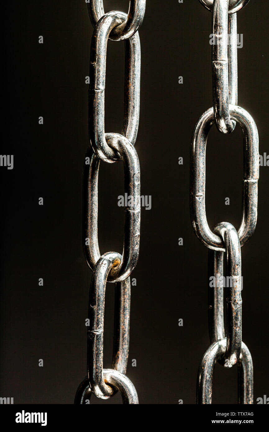 Strong chain black background Stock Photo - Alamy
