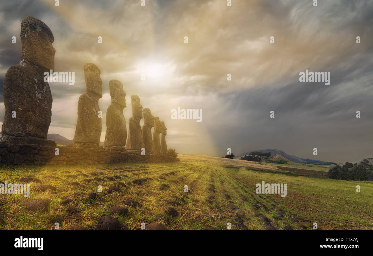 Panoramic view of the complex of statues of Easter Island in backlit ...