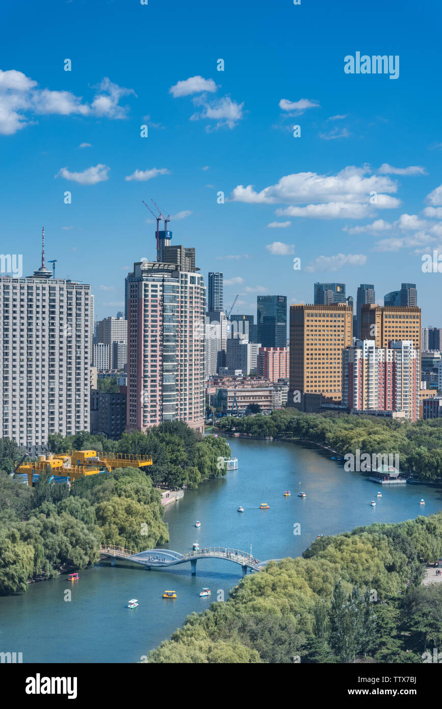 Autumn overlooking urban buildings, woods and rivers in Shenyang, China ...