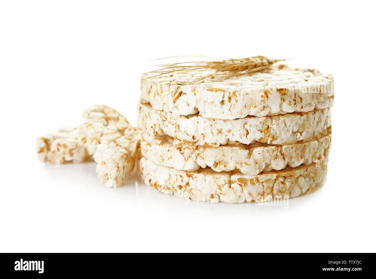 Round rice crispbreads and spikelets on white background Stock Photo ...
